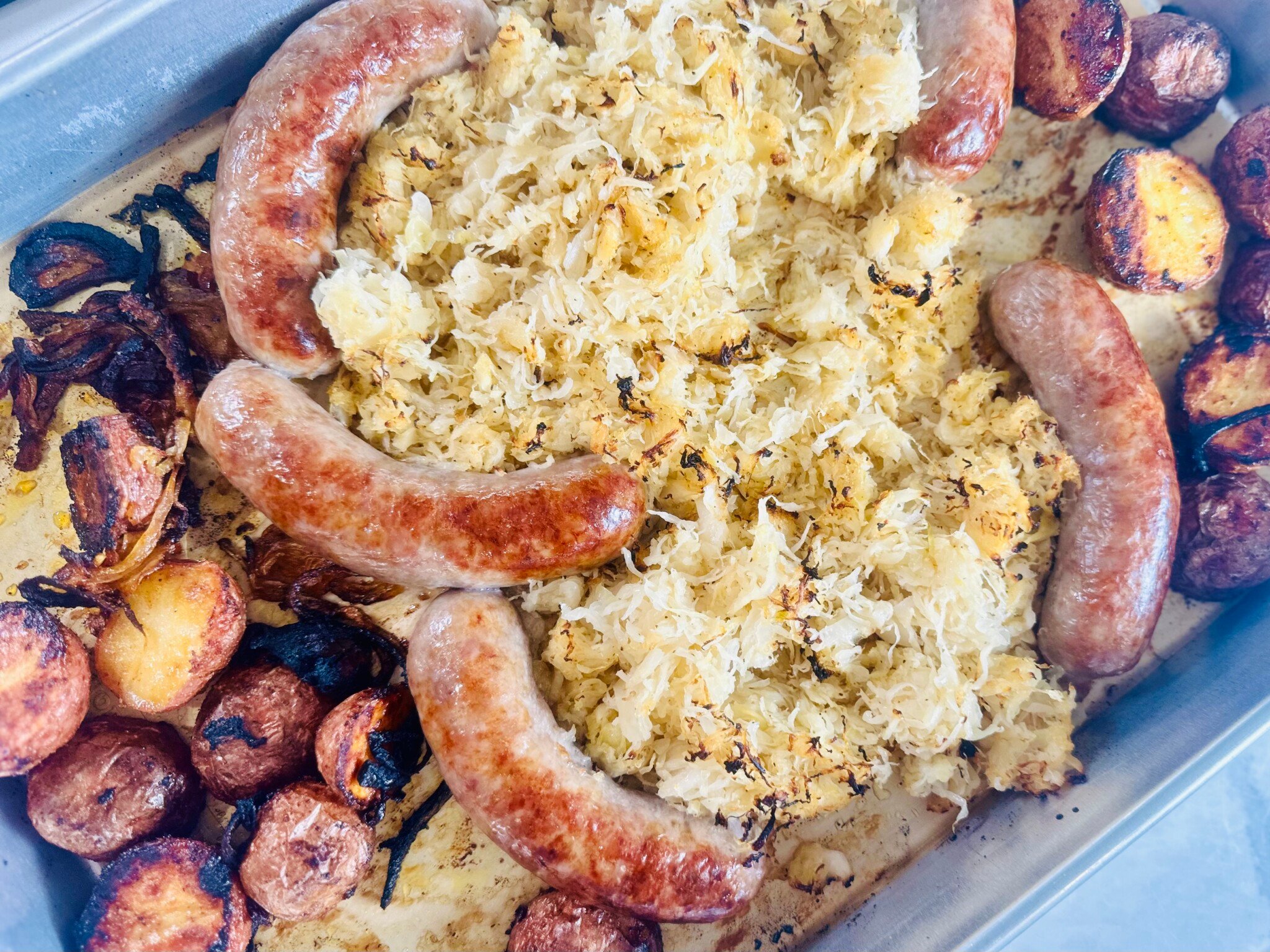 Sheet Pan Bratwurst with Sauerkraut Roasted New Potatoes