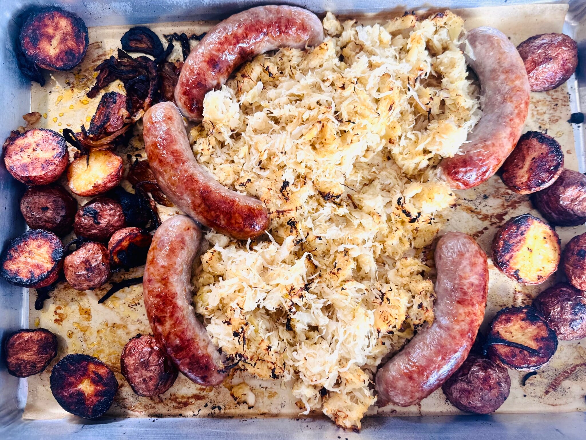 Sheet Pan Bratwurst with Sauerkraut Roasted New Potatoes